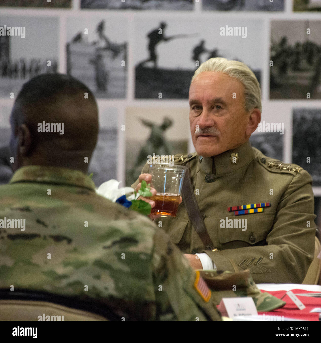 Dane Coffman, dressed as Gen. John J. "Blackjack" Pershing, chats with ...