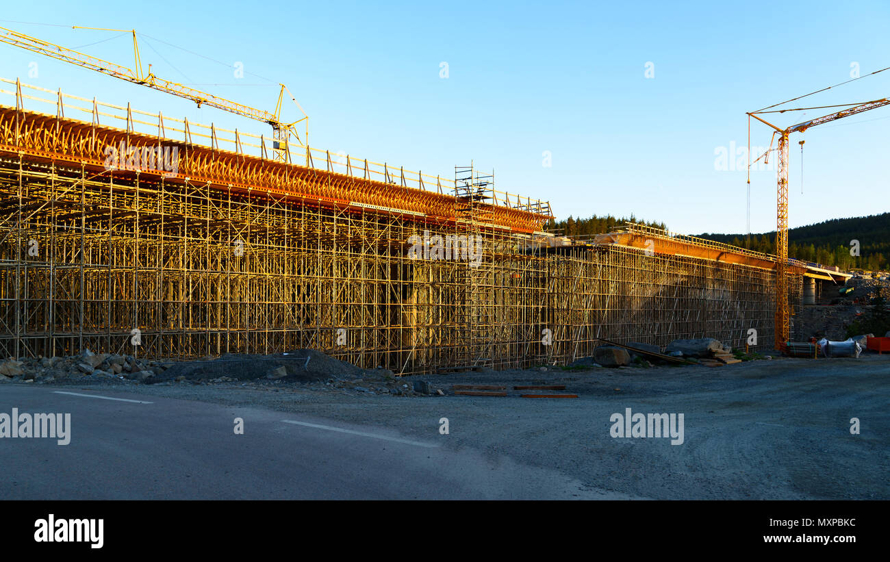 Ongoing construction of a road bridge on a sunny evening. Outside ...