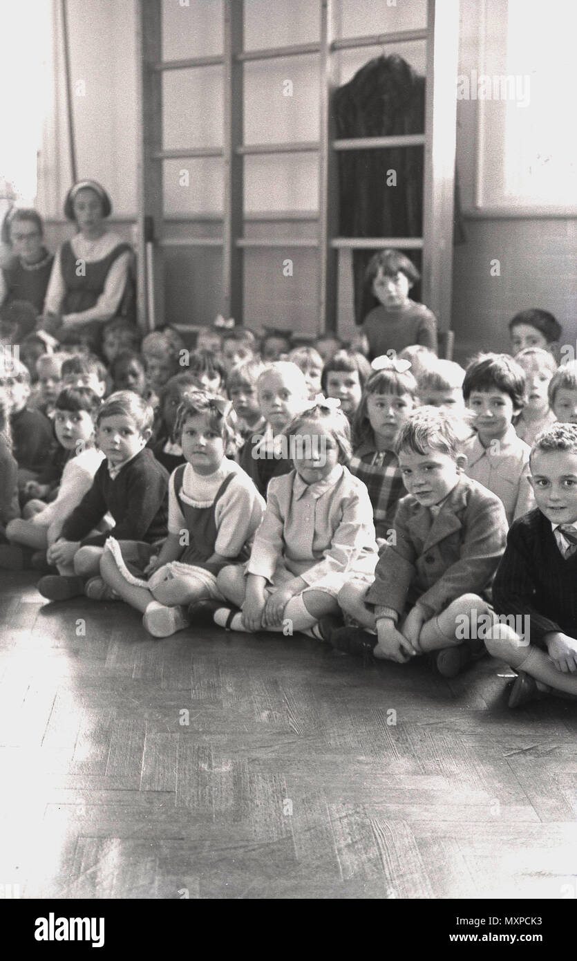 1964, historical, group of primary school children sitting together ...