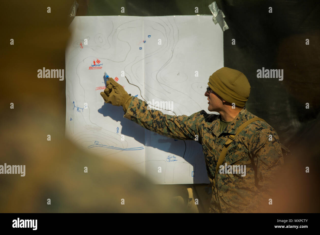 U.S. Marine 1st Lt. Alex Tassone, third platoon commander, issues ...