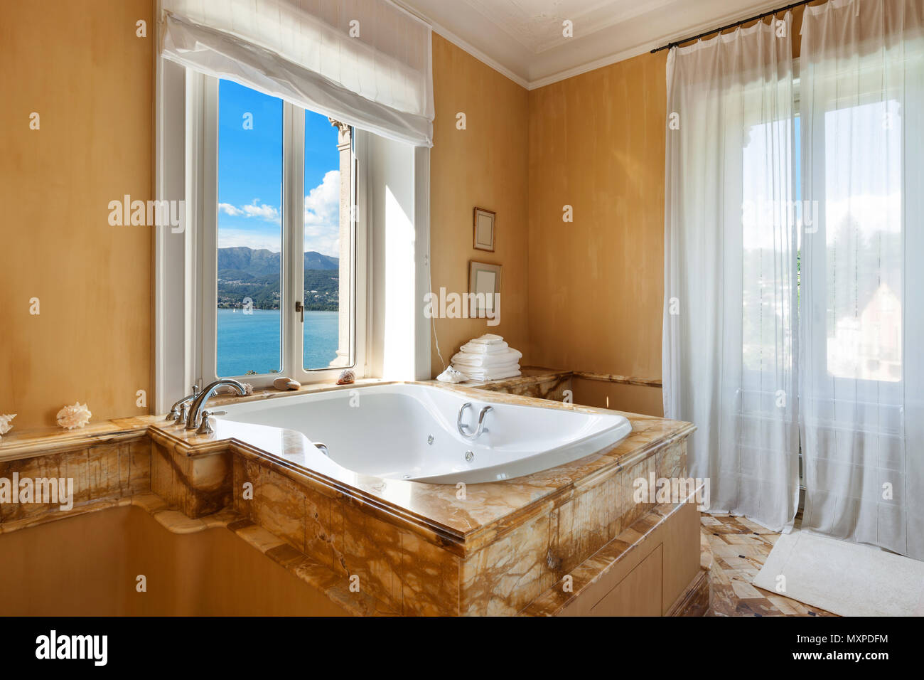 Interior of a luxury mansion, beautiful bathroom with jacuzzi Stock ...