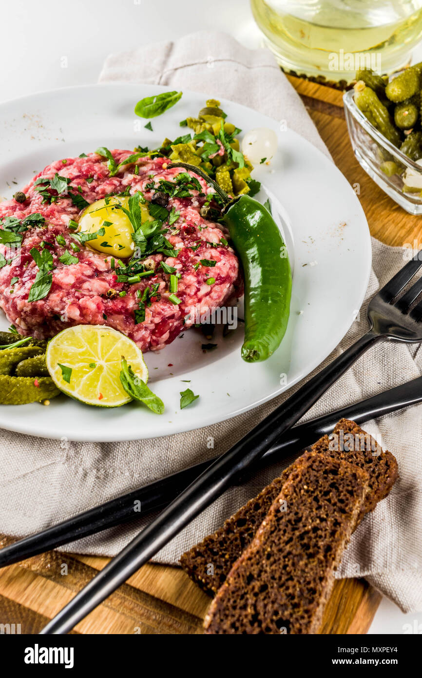 French cuisine, beef steak tartare with raw quail egg yolk, pickled ...
