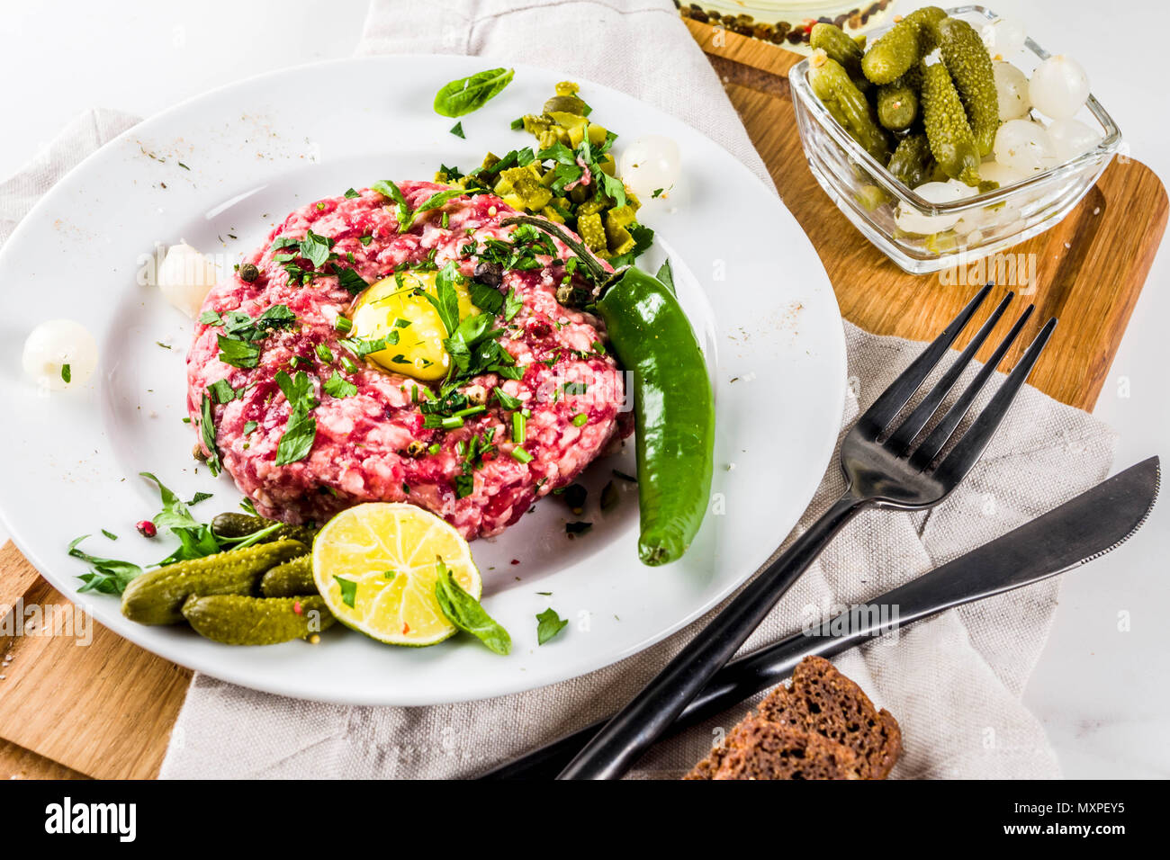 French cuisine, beef steak tartare with raw quail egg yolk, pickled ...