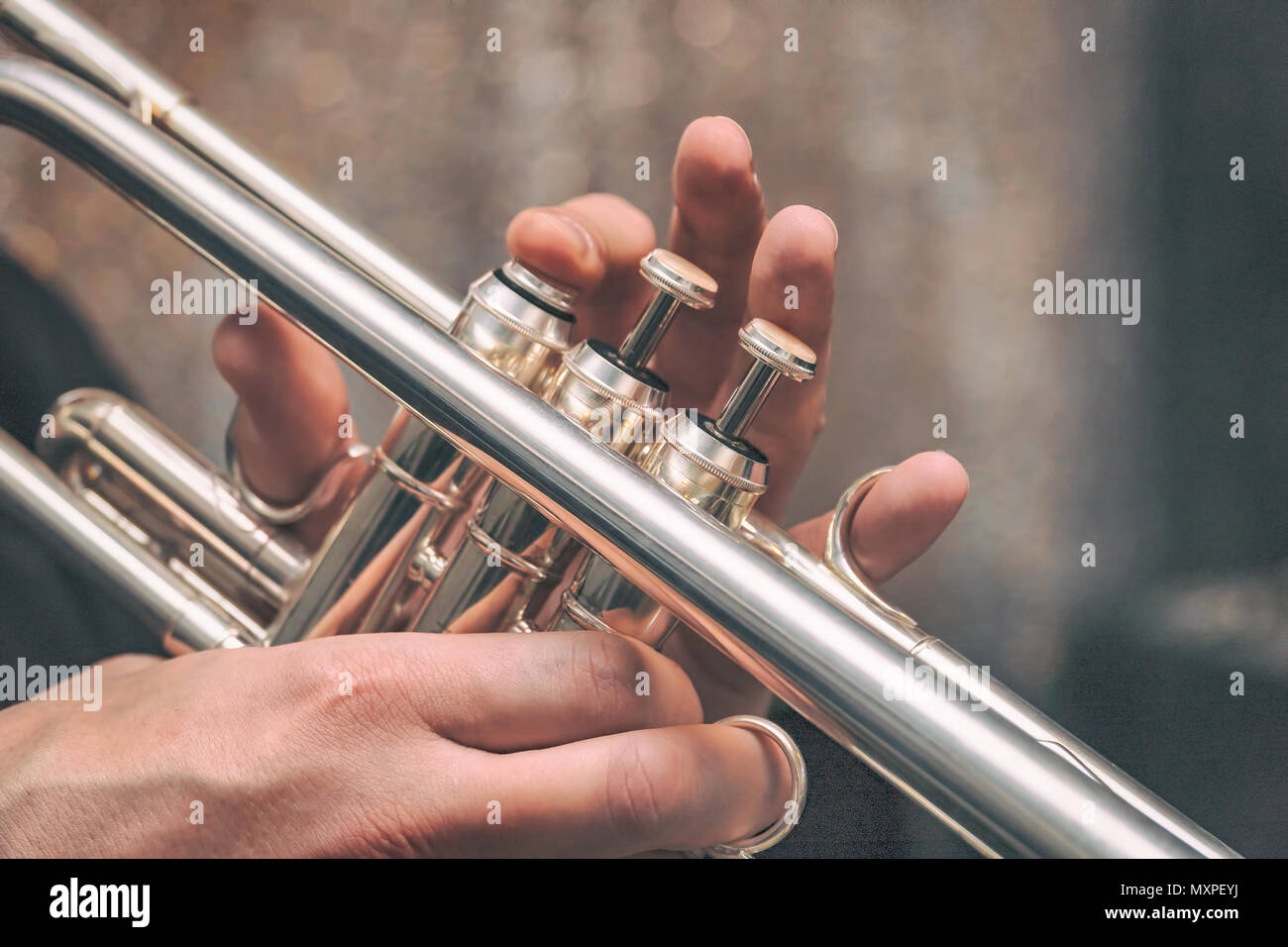 Hand of the Trumpeter on the buttons of trumpet Stock Photo - Alamy