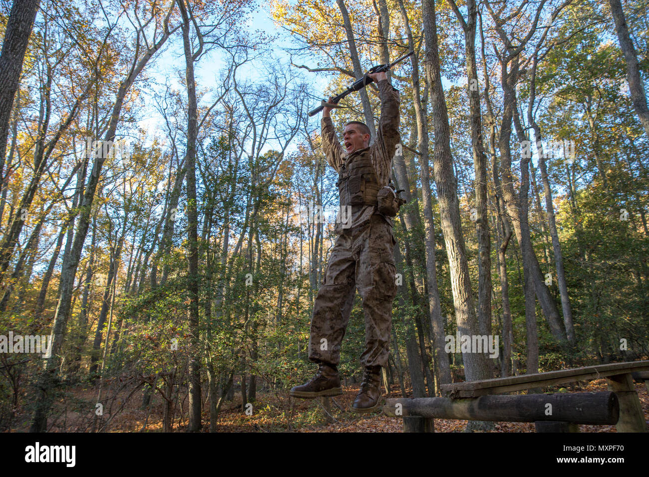 A U.S. Marine candidate with Officer Candidate School (OCS) jumps off a ...