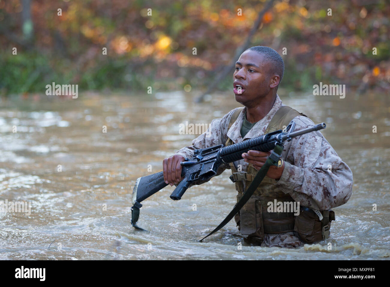 A U.S. Marine candidate with Officer Candidate School (OCS) maneuvers ...