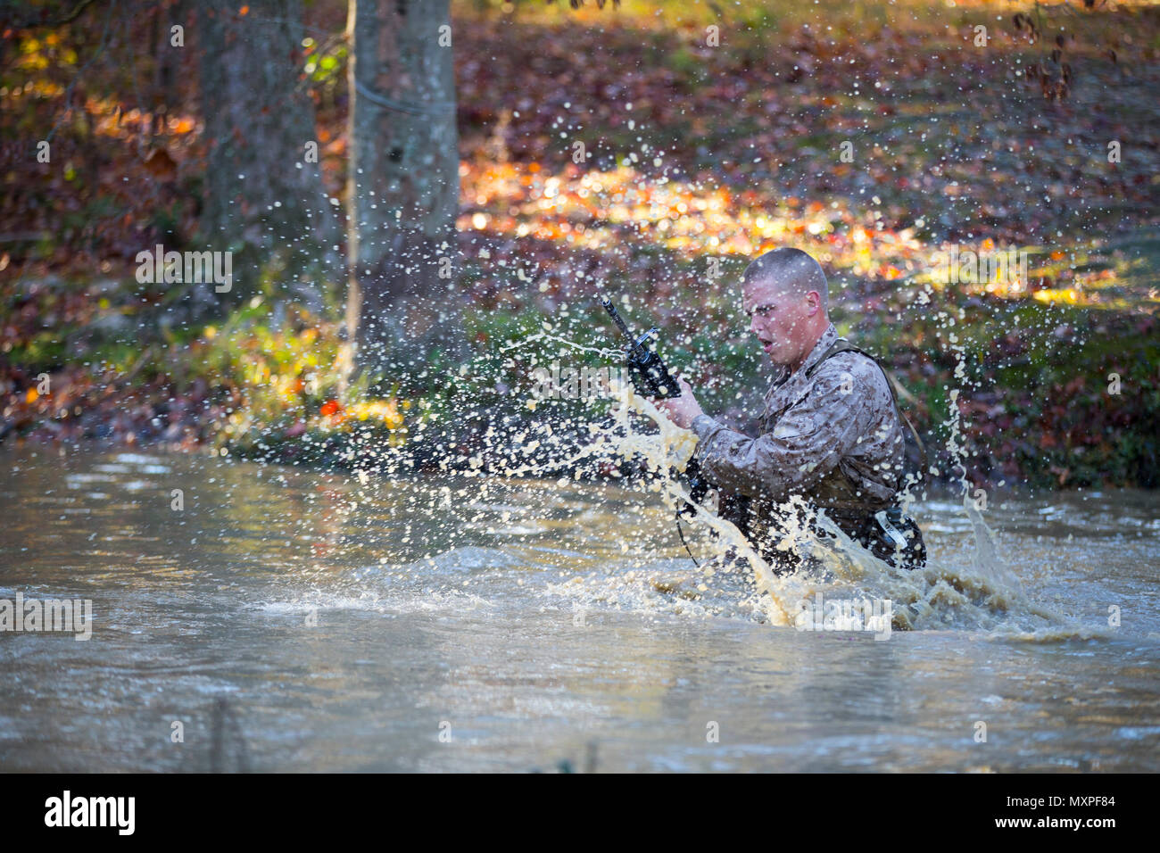A U.S. Marine candidate with Officer Candidate School (OCS) splashes ...