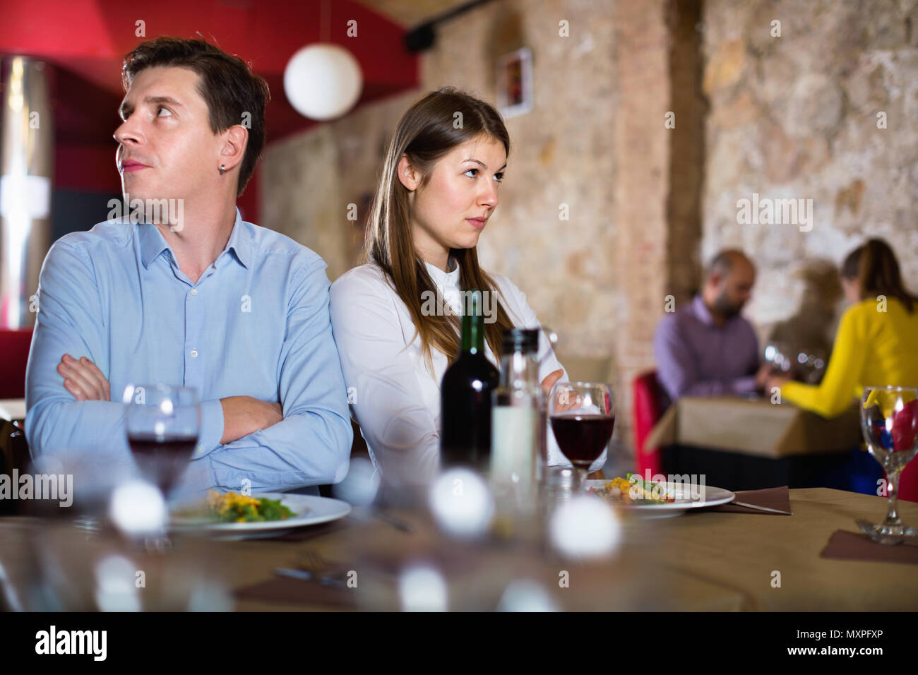 Couple dinner restaurant serious hi-res stock photography and images ...