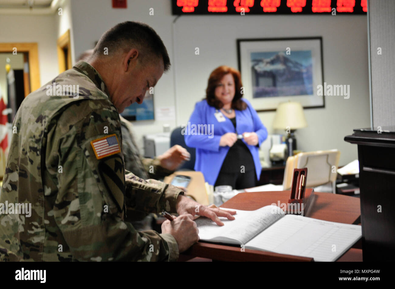 Gen. Daniel Allyn, Vice Chief of Staff of the Army, signs in to a guest ...