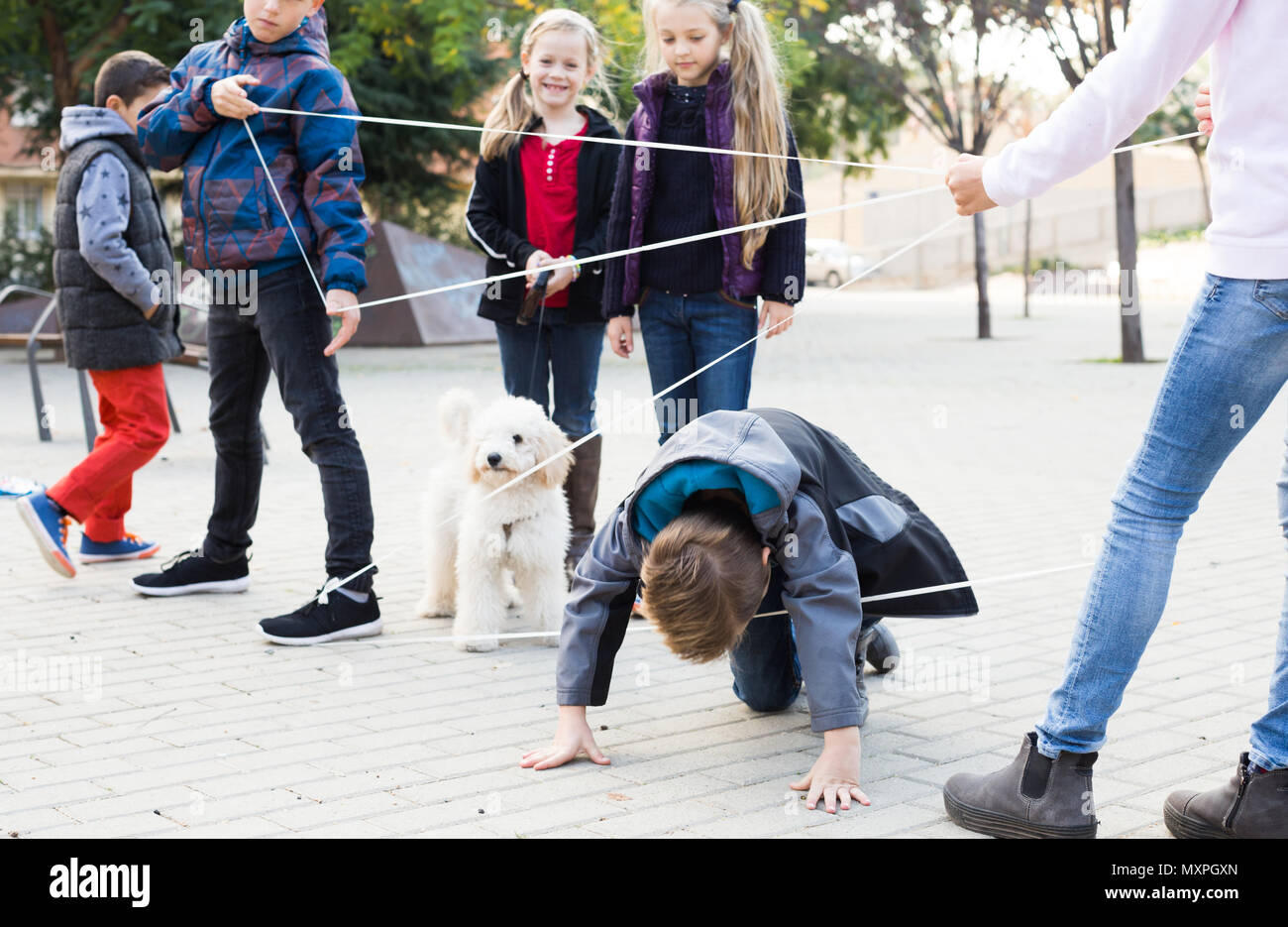 Children playing an elastic hi-res stock photography and images - Alamy