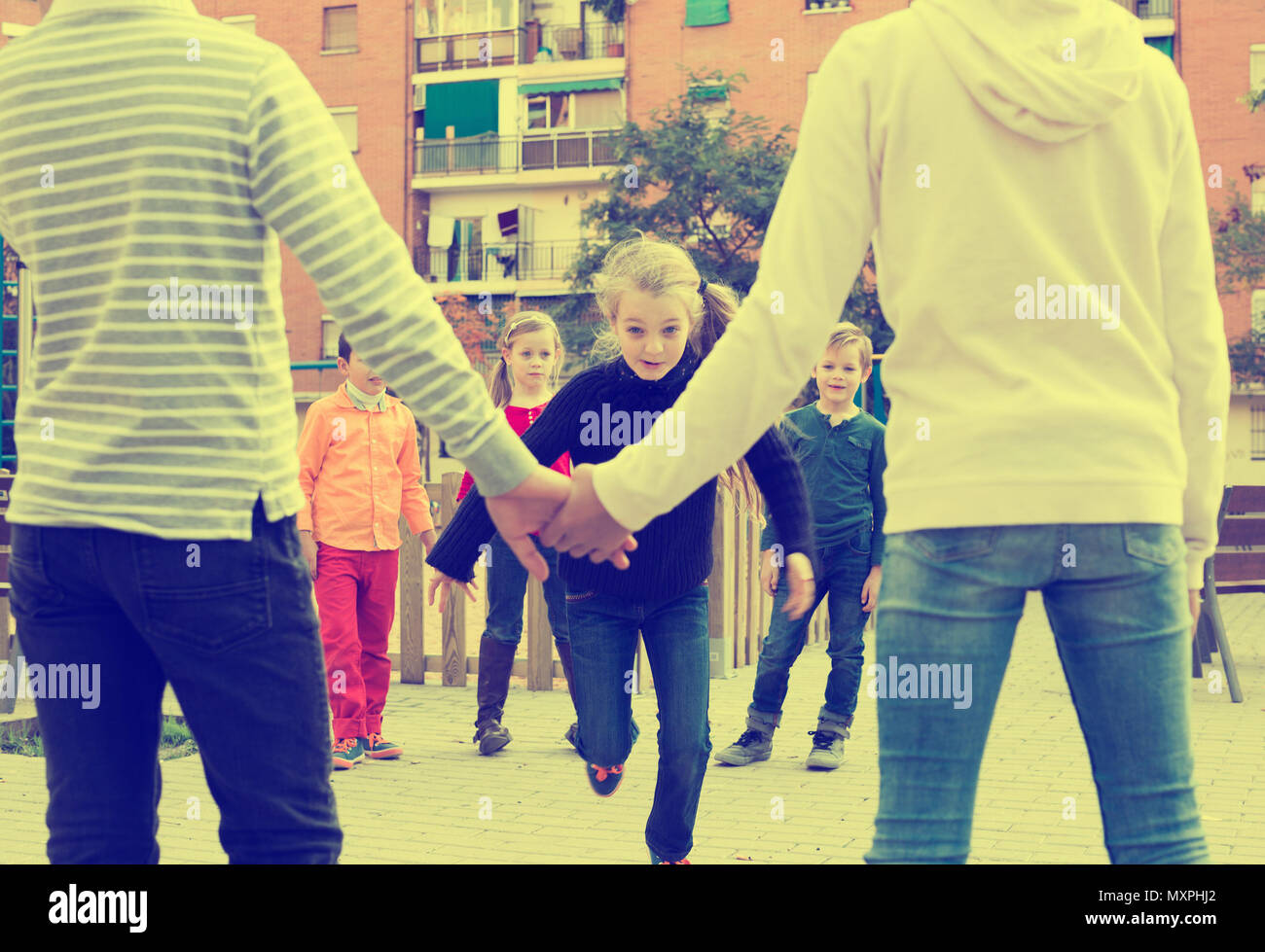 Friendly kids have fun playing in forcing the city gates Stock Photo ...