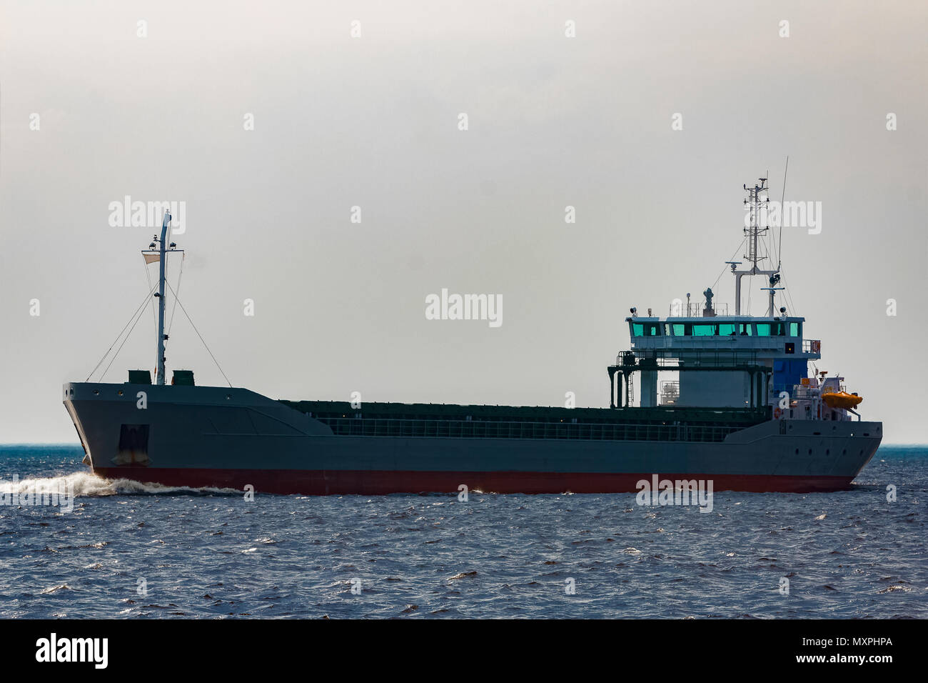 Grey bulker ship. Logistics and merchandise transportations Stock Photo ...