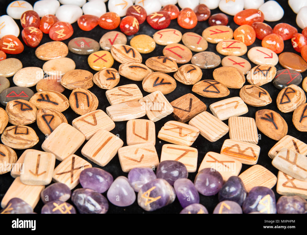 Scattered magic runes made of different materials Stock Photo - Alamy