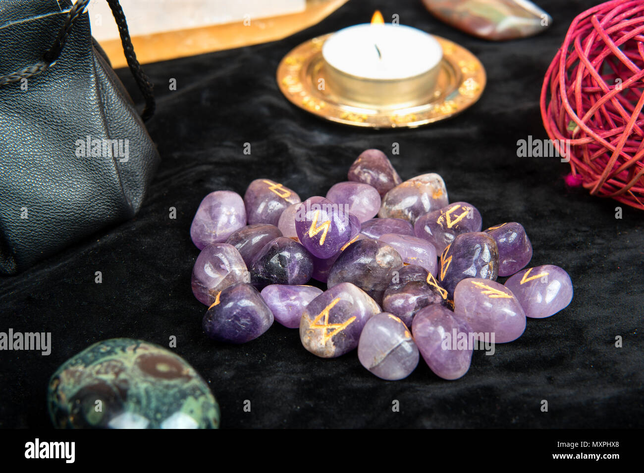 Runes for divination with magical attributes on the table Stock Photo ...