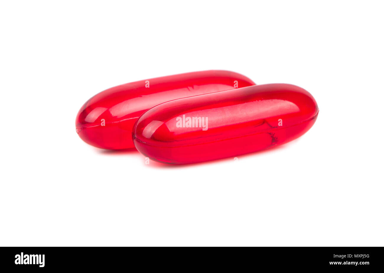 Two red pill capsule isolated on white background Stock Photo - Alamy