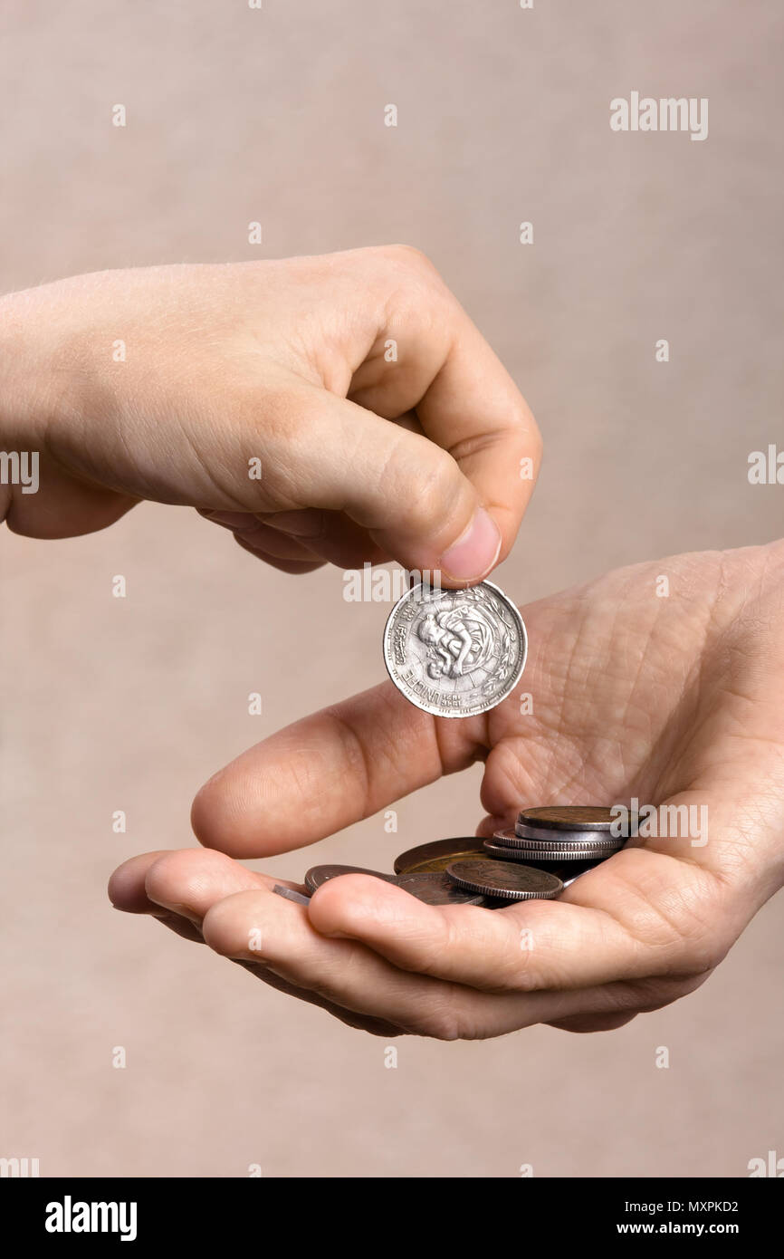 Hand Giving Coins
