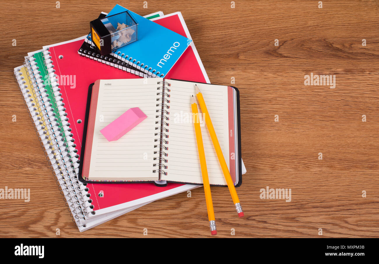 School notebooks on desk hi-res stock photography and images - Alamy