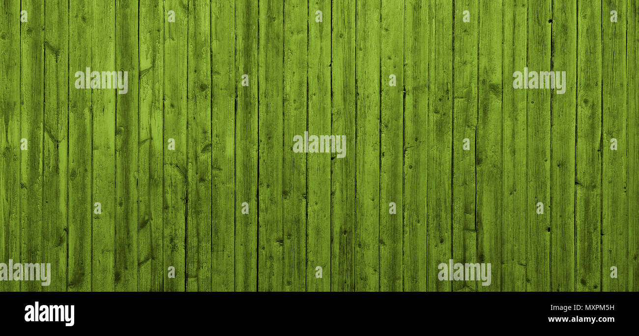 Green wooden wall with vertical planks. Close up of an old wooden fence ...