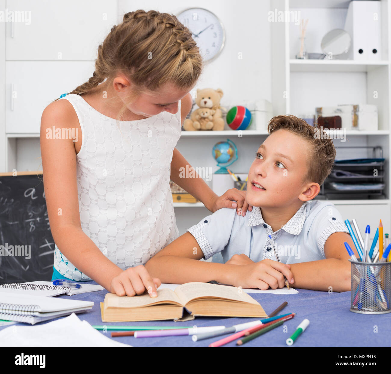 Sister helping brother hi-res stock photography and images - Alamy