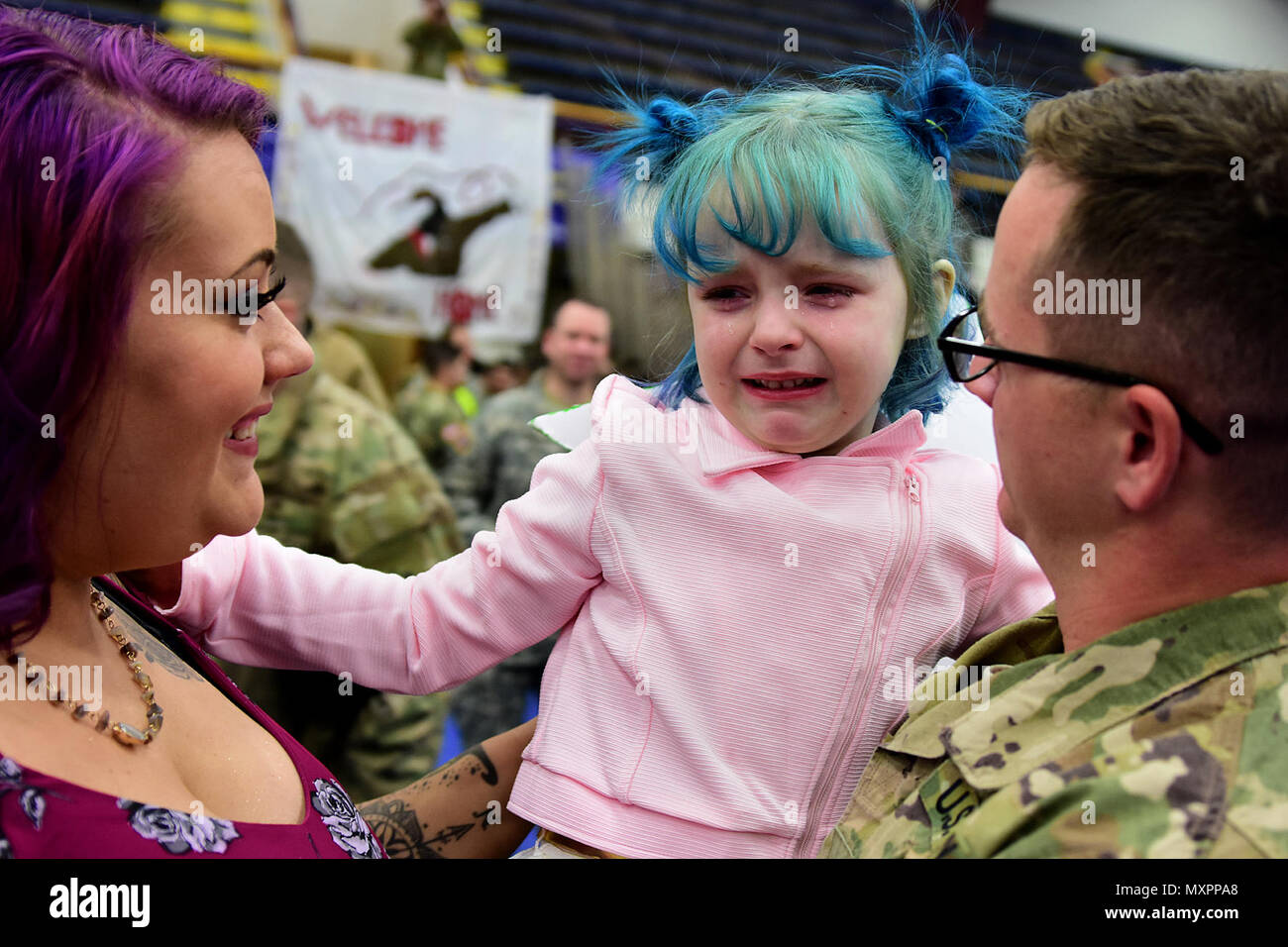 Brittany and Sgt. Jonathan Lowe console 6-year-old Rose Lowe Dec. 1 at ...