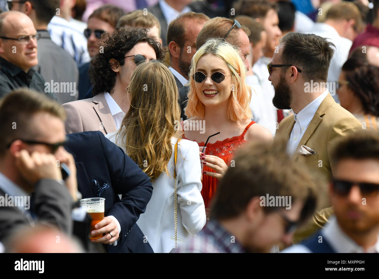 Racegoers enjoying drinks during Haydock Park Races Stock Photo - Alamy