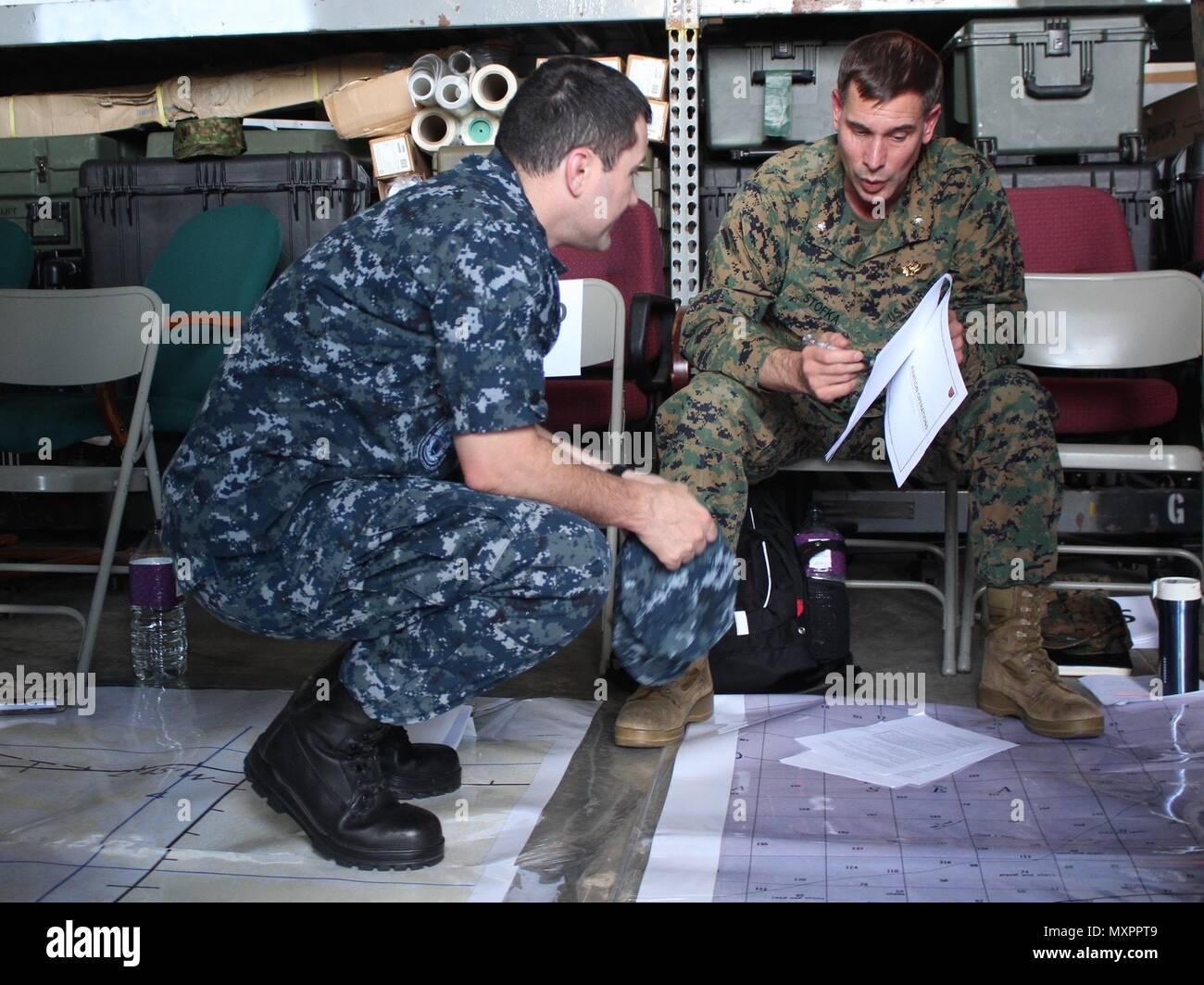 U.S. Marine Corps Lt. Col. Jonathan M. Stofka speaks to U.S. Navy Lt ...