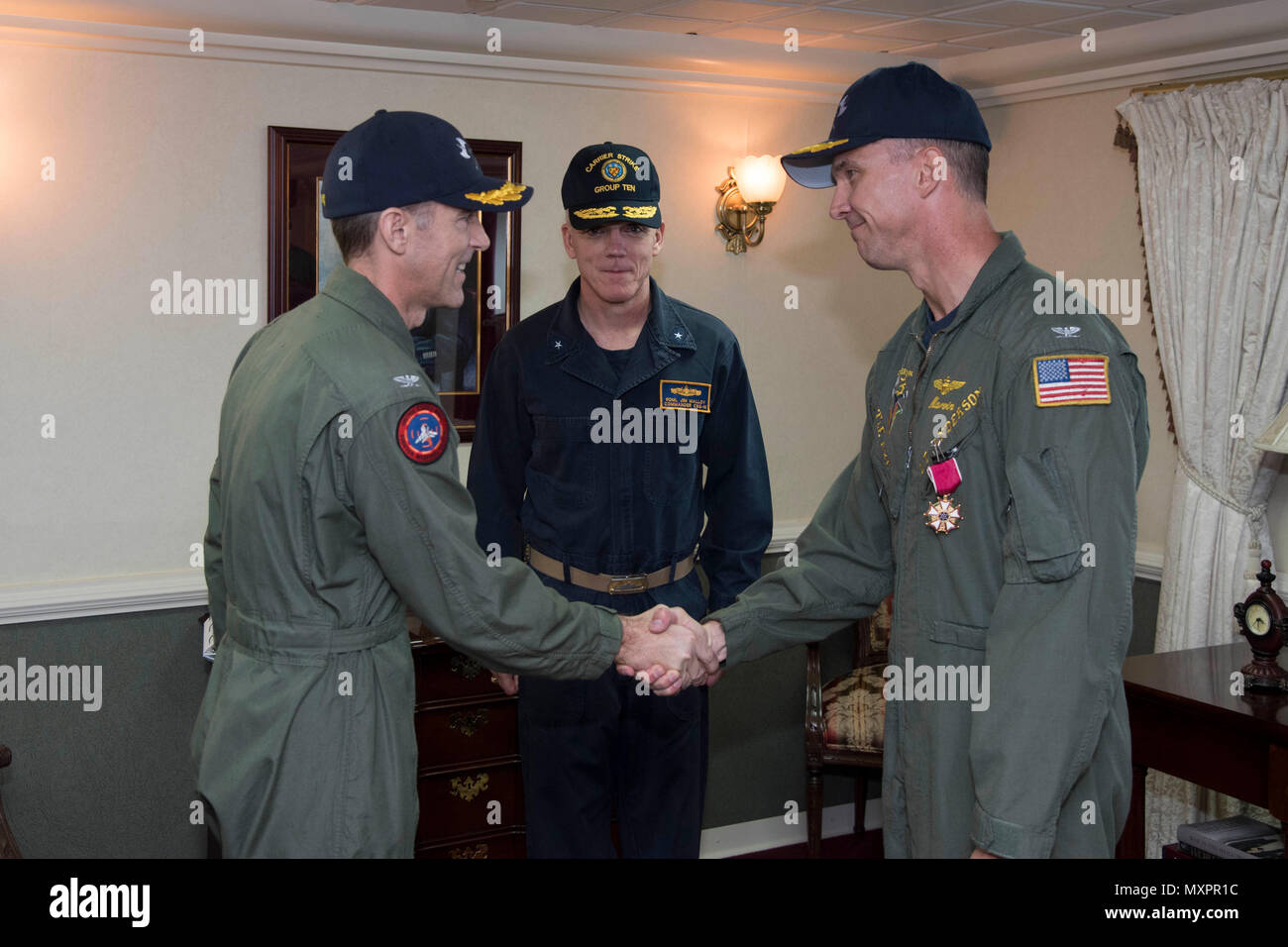 161202-N-KK394-021 RED SEA (Dec. 2, 2016) Rear Adm. Jim Malloy, center ...