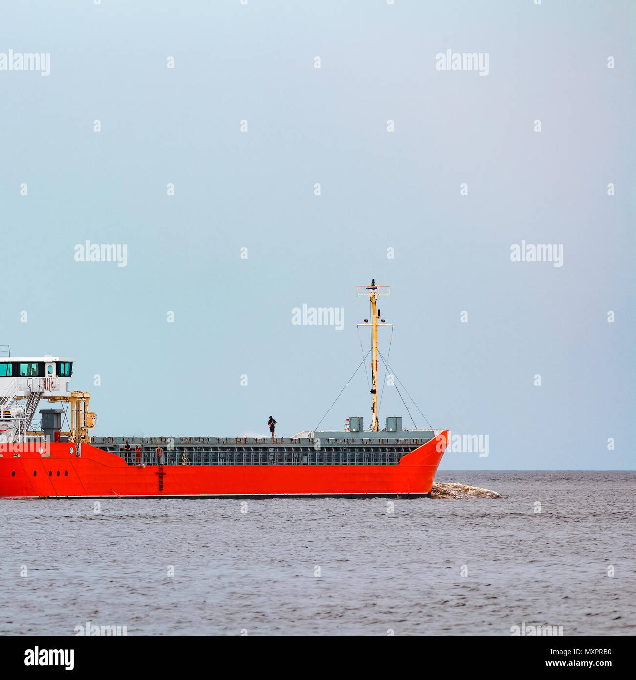 Orange cargo ship. Logistics and merchandise transportations Stock ...