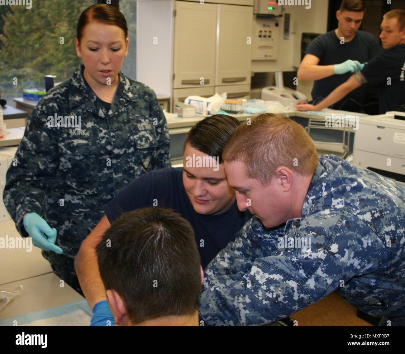 Petty Officer 3rd Class Kayla Kirk, assists with hospital corpsmen ...