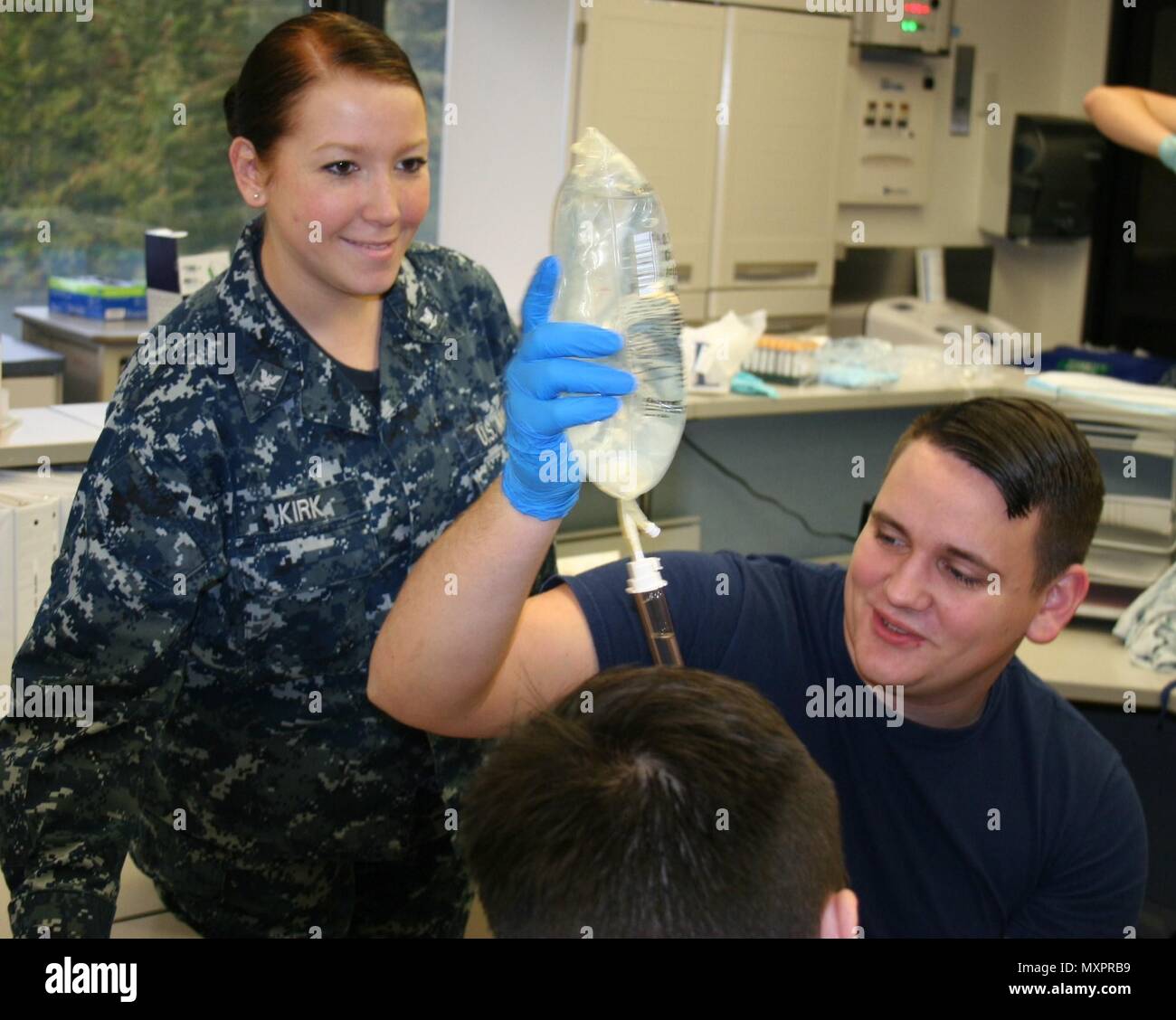 Petty Officer 3rd Class Kayla Kirk, assists with hospital corpsmen ...
