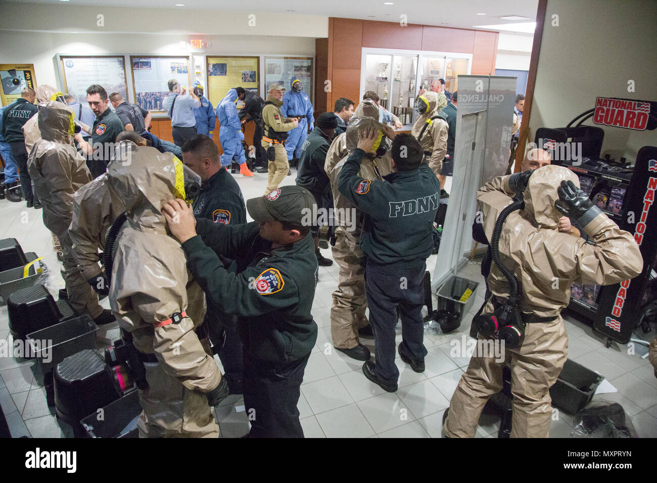 Firefighters, assigned to New York Fire Department HAZMAT Team, check ...