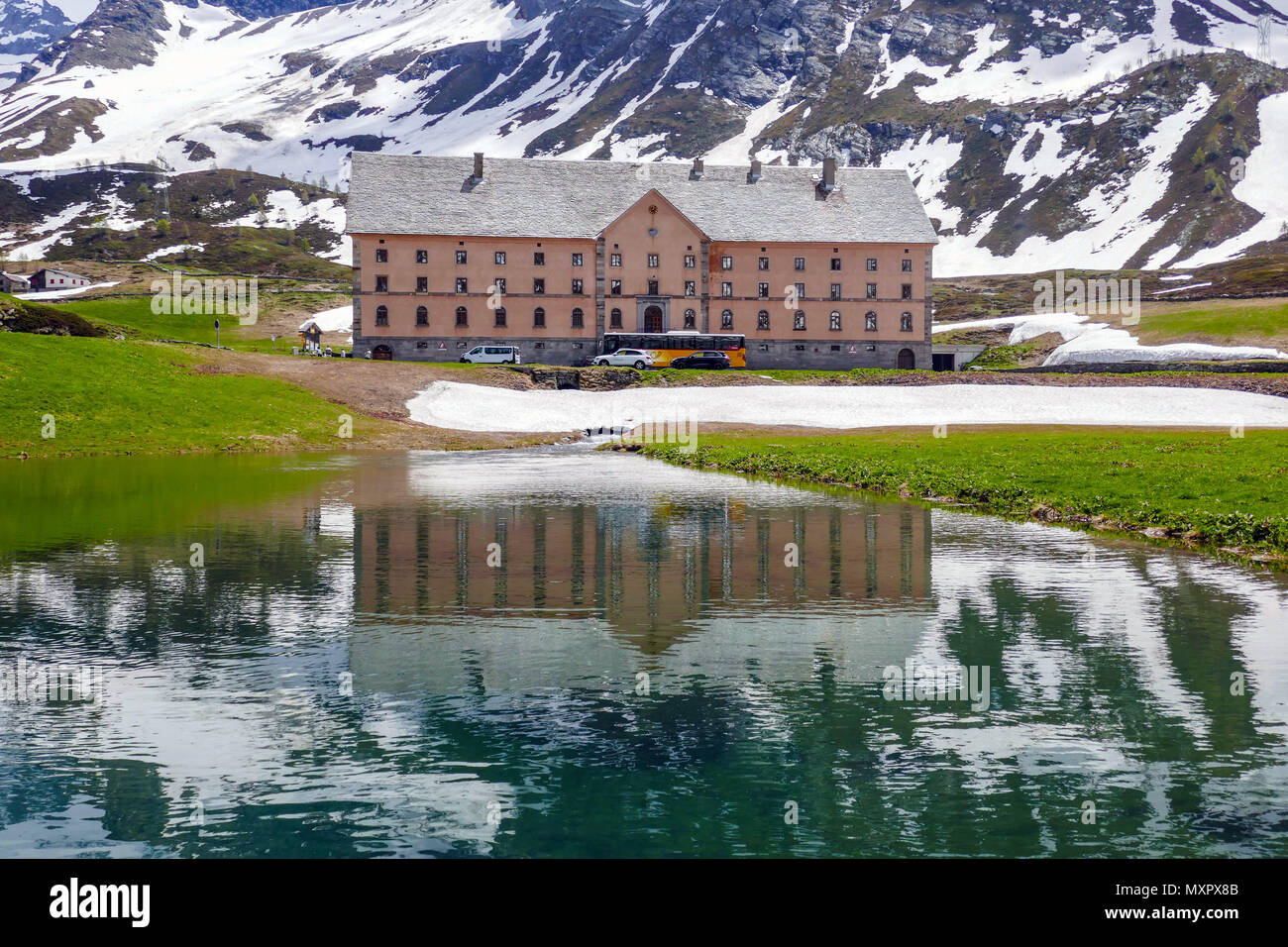 Simplon Hospitz yellow post bus and snowy weather in the mountains on ...