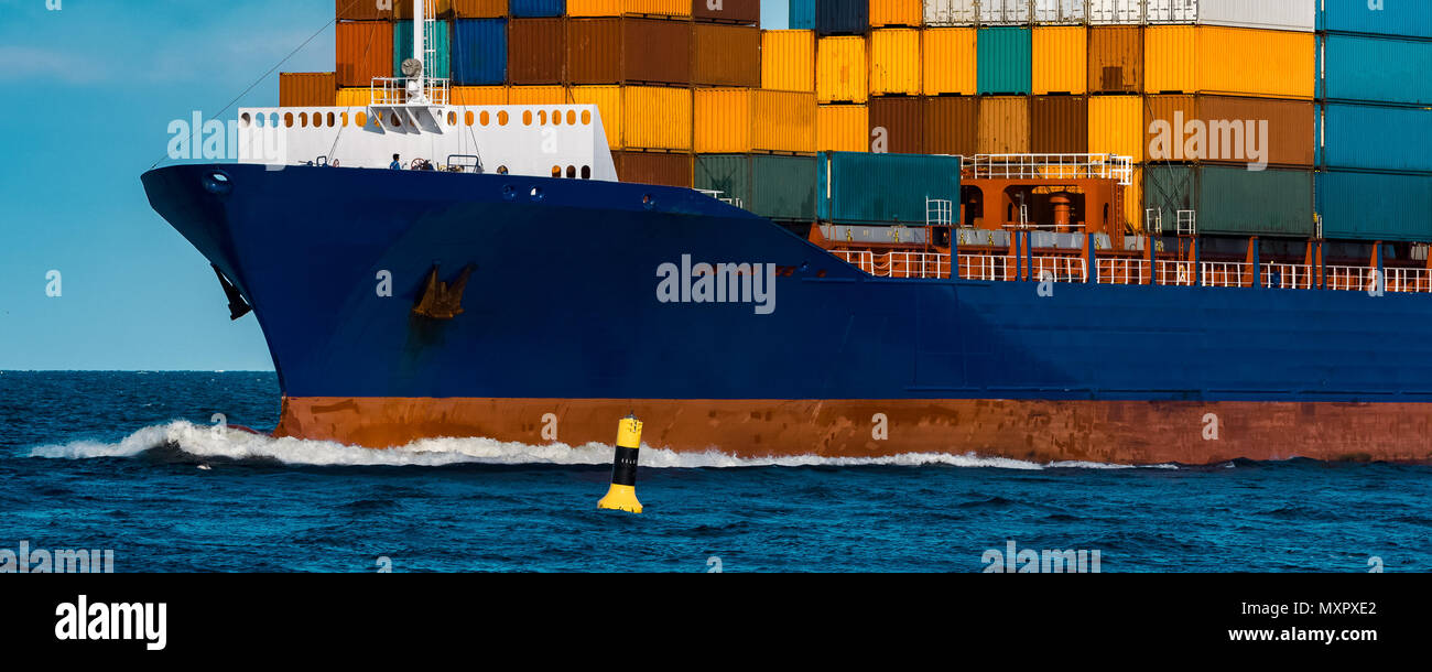 Blue container ship in travel. Logistics and freight industry Stock ...