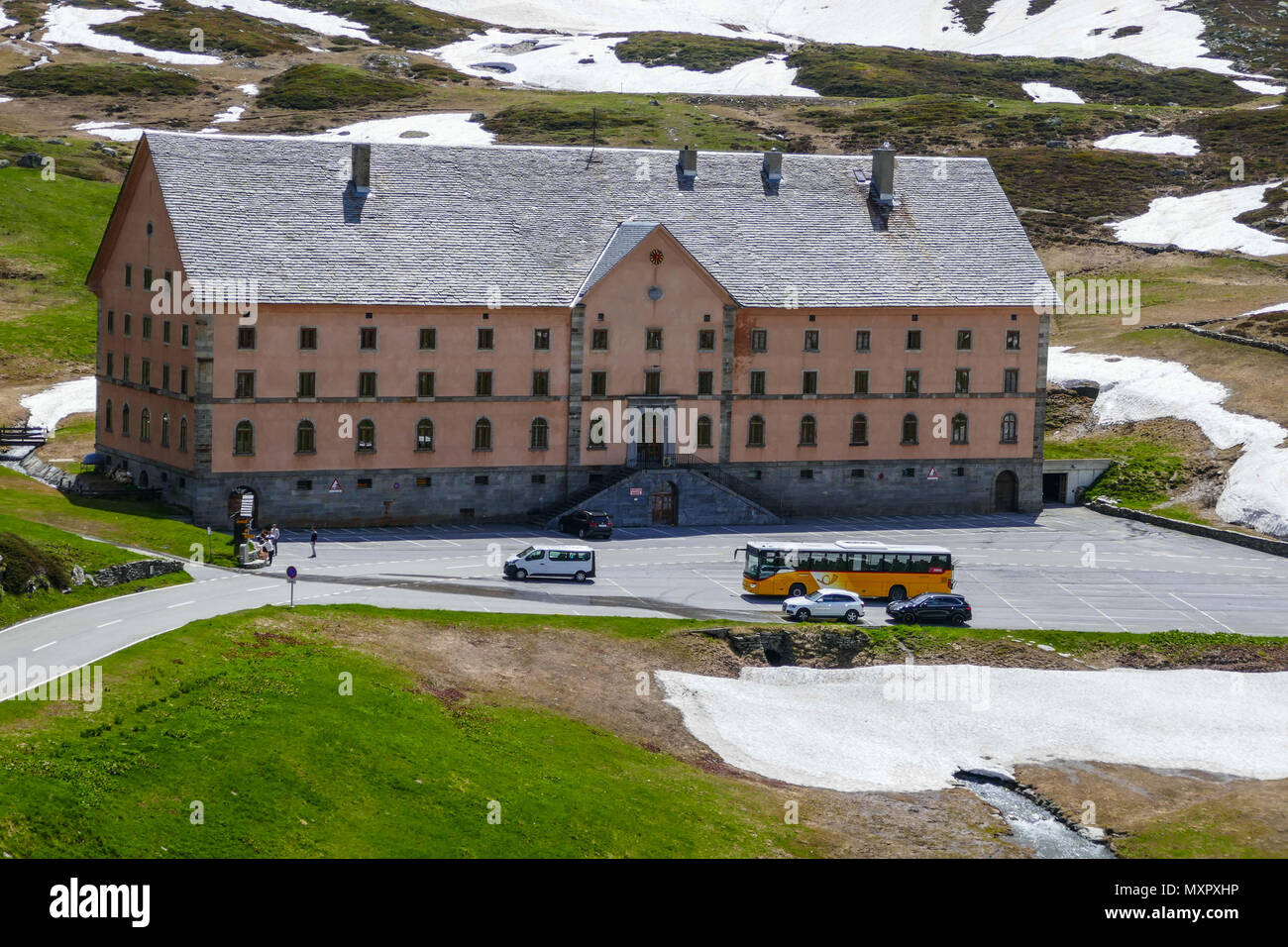 Simplon Hospitz yellow post bus and snowy weather in the mountains on ...