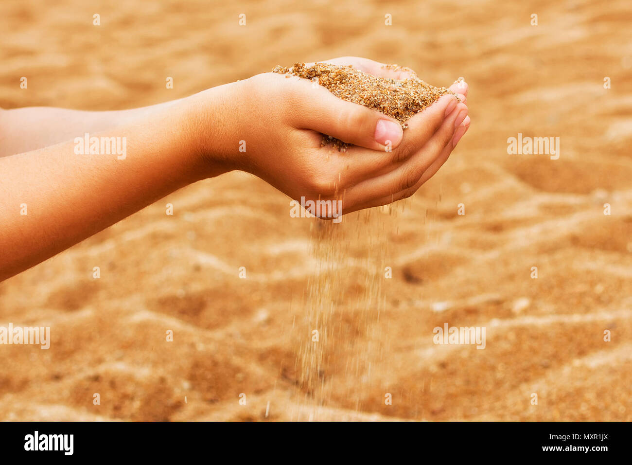 Sand Falling Through Hands High Resolution Stock Photography and Images ...