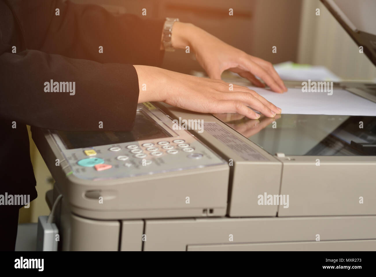 Woman using photocopier hi-res stock photography and images - Alamy