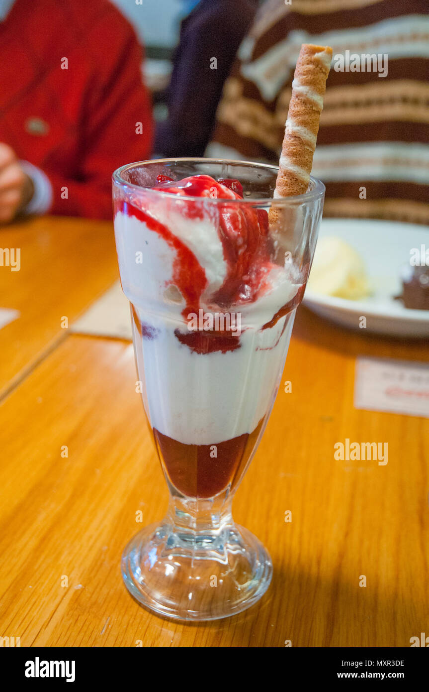 Ice cream with strawberry syrup Stock Photo - Alamy