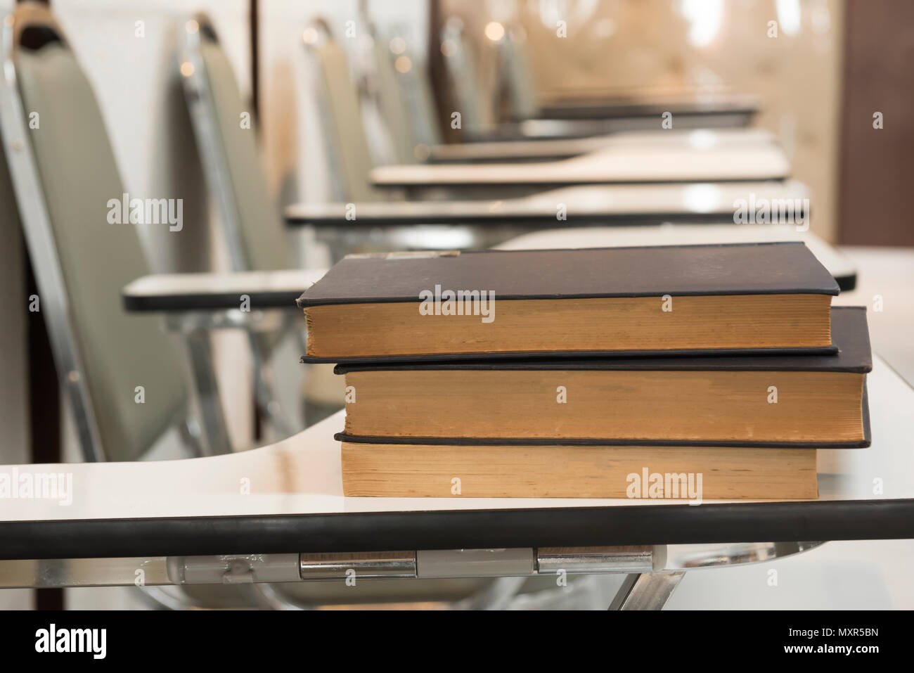 Book on the table in the classroom Stock Photo - Alamy