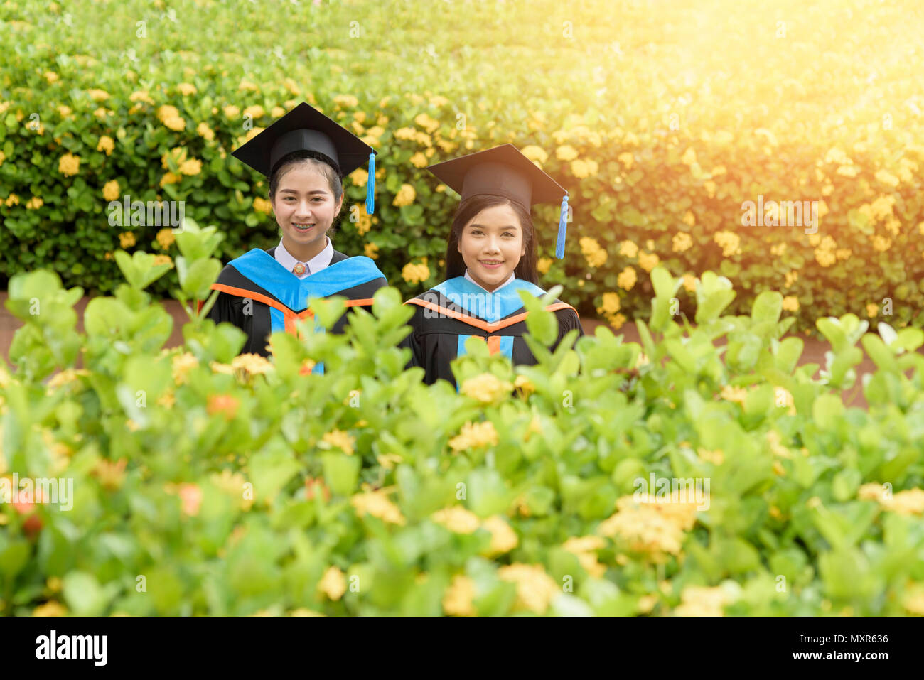Two female graduates congratulate the graduation ceremony Stock Photo ...