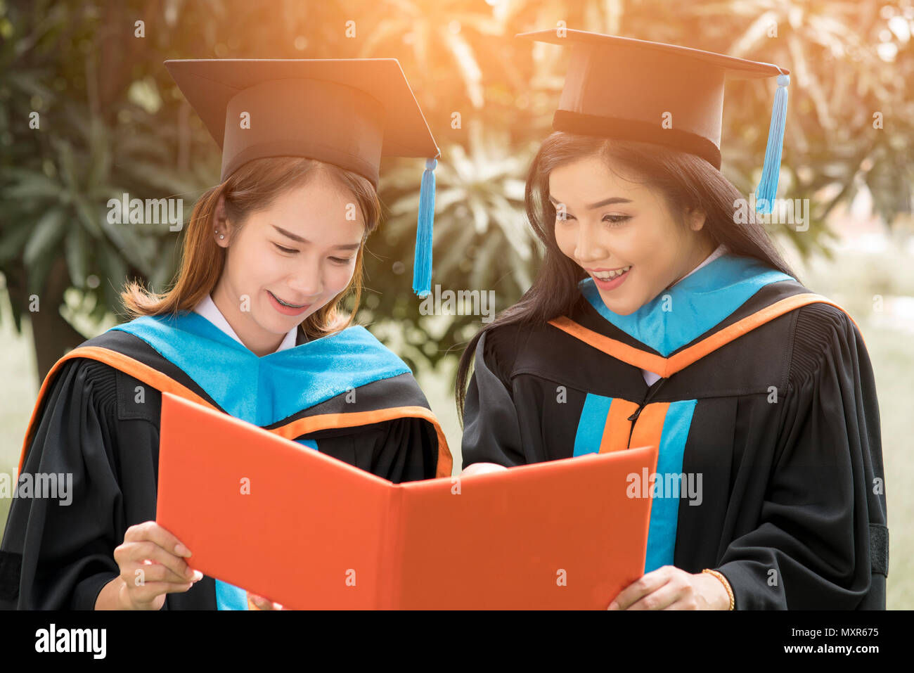 Two female graduates congratulate the graduation ceremony Stock Photo ...