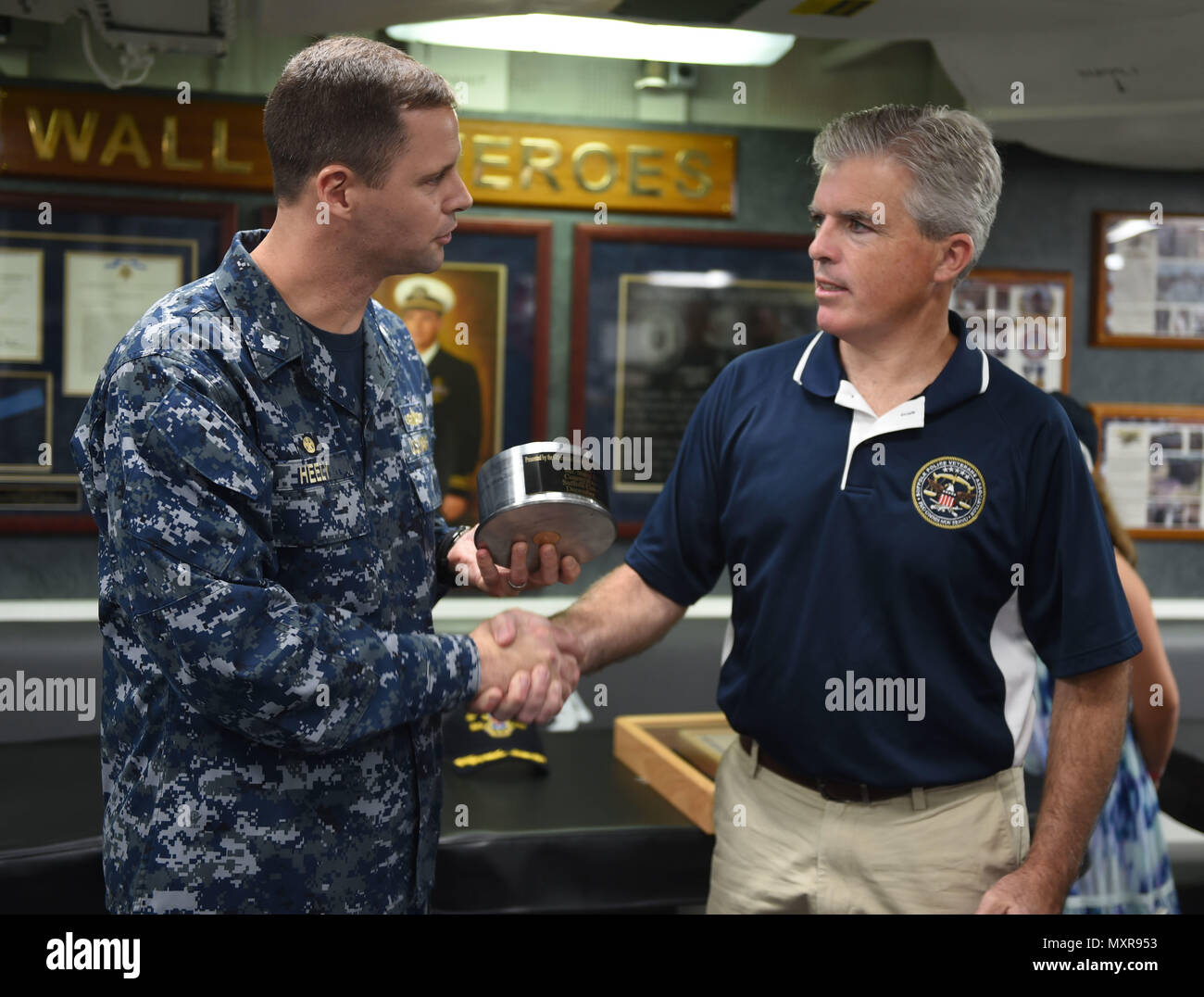The commanding officer of USS Michael Murphy (DDG 112) presented a ...