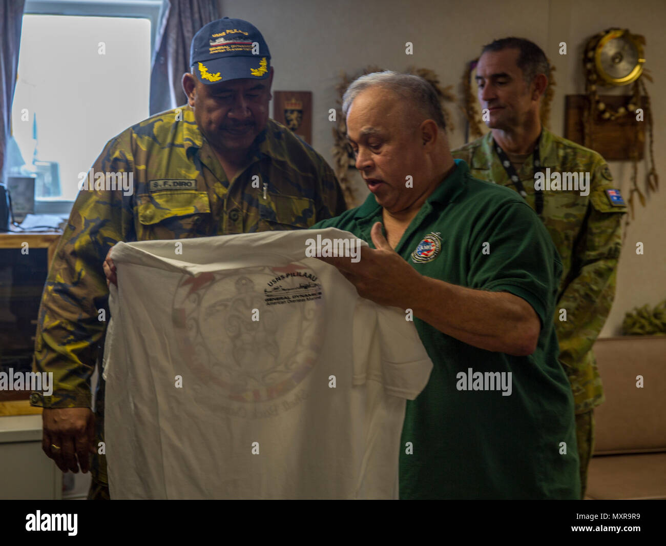 Contracted mariner Capt. Tom Madden, center, master of maritime ...