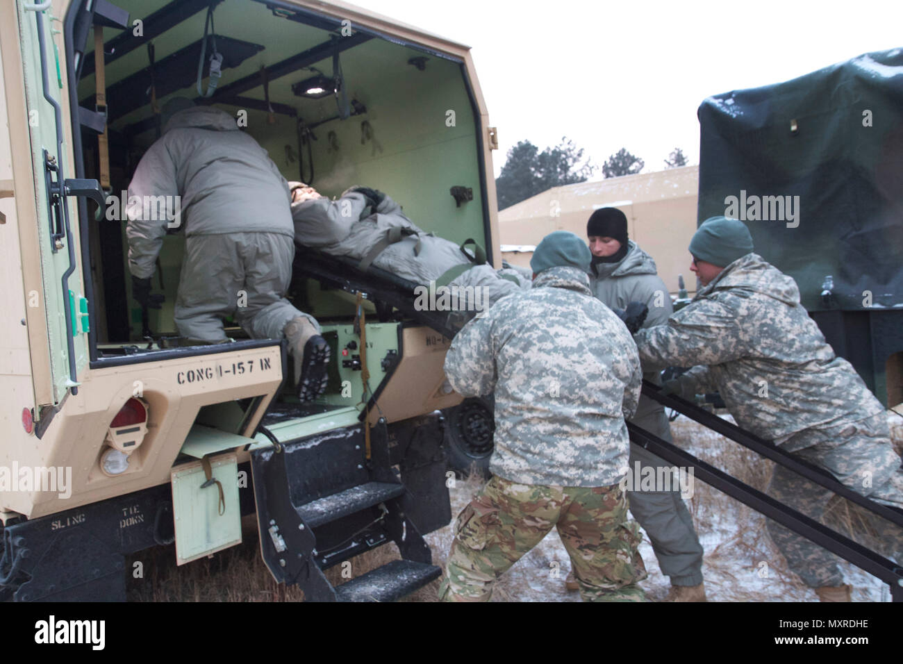 Medics assigned to the 1st Battalion, 157th Infantry Regiment, Colorado ...