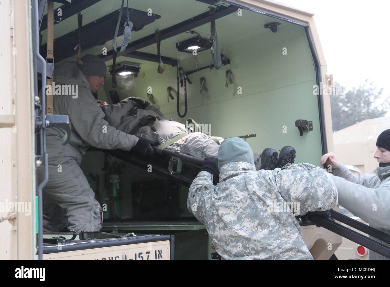 Medics assigned to the 1st Battalion, 157th Infantry Regiment, Colorado ...