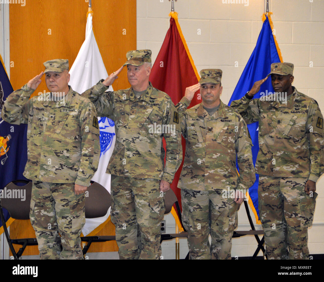 New York Army National Guard Soldiers render a salute to the U.S. flag during the playing of the ...