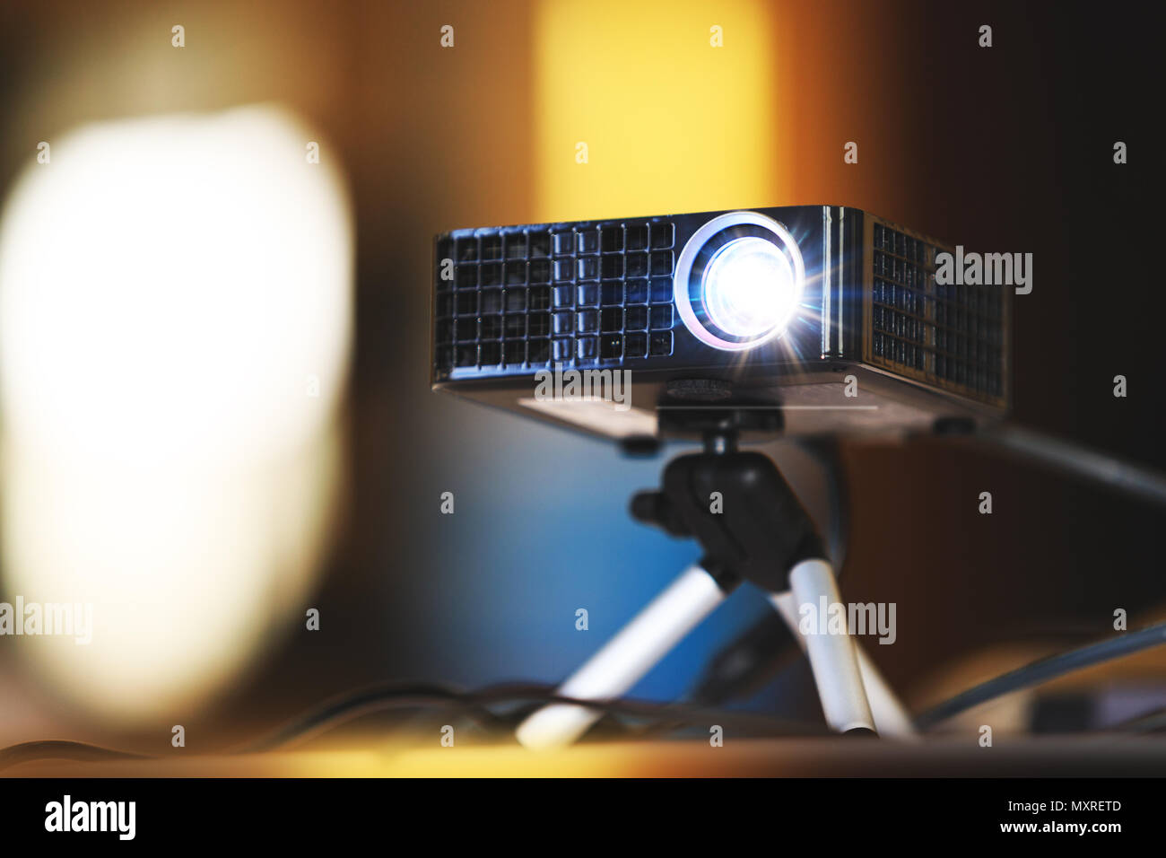 Real projector at business conference or presentation in the office ...