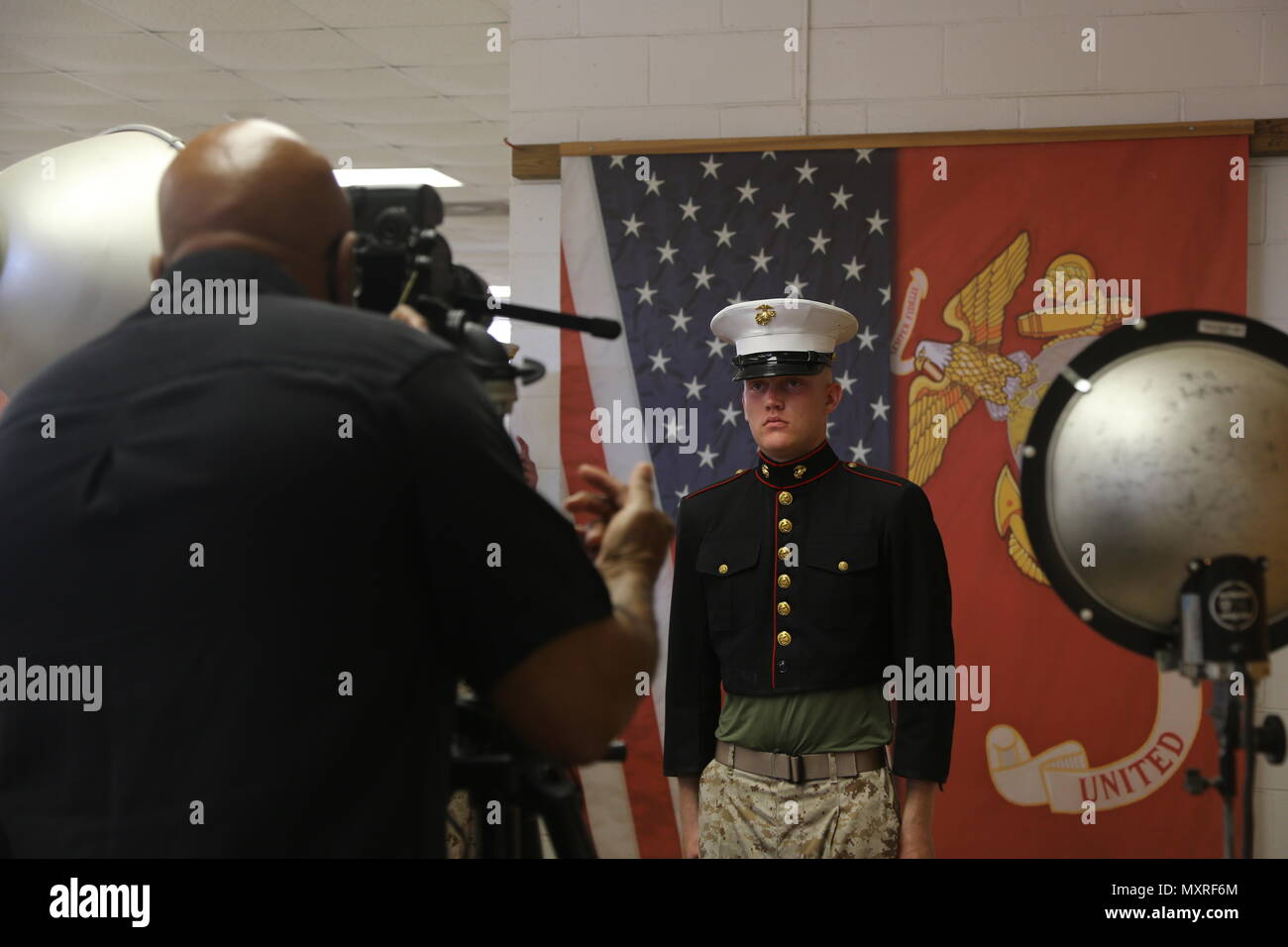 Christopher Deans, a Recruit Photographer, takes an official photo of a ...
