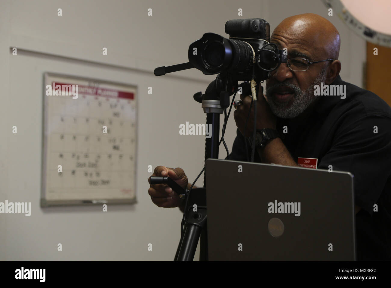 Christopher Deans, a Recruit Photographer, takes an official photo of a ...