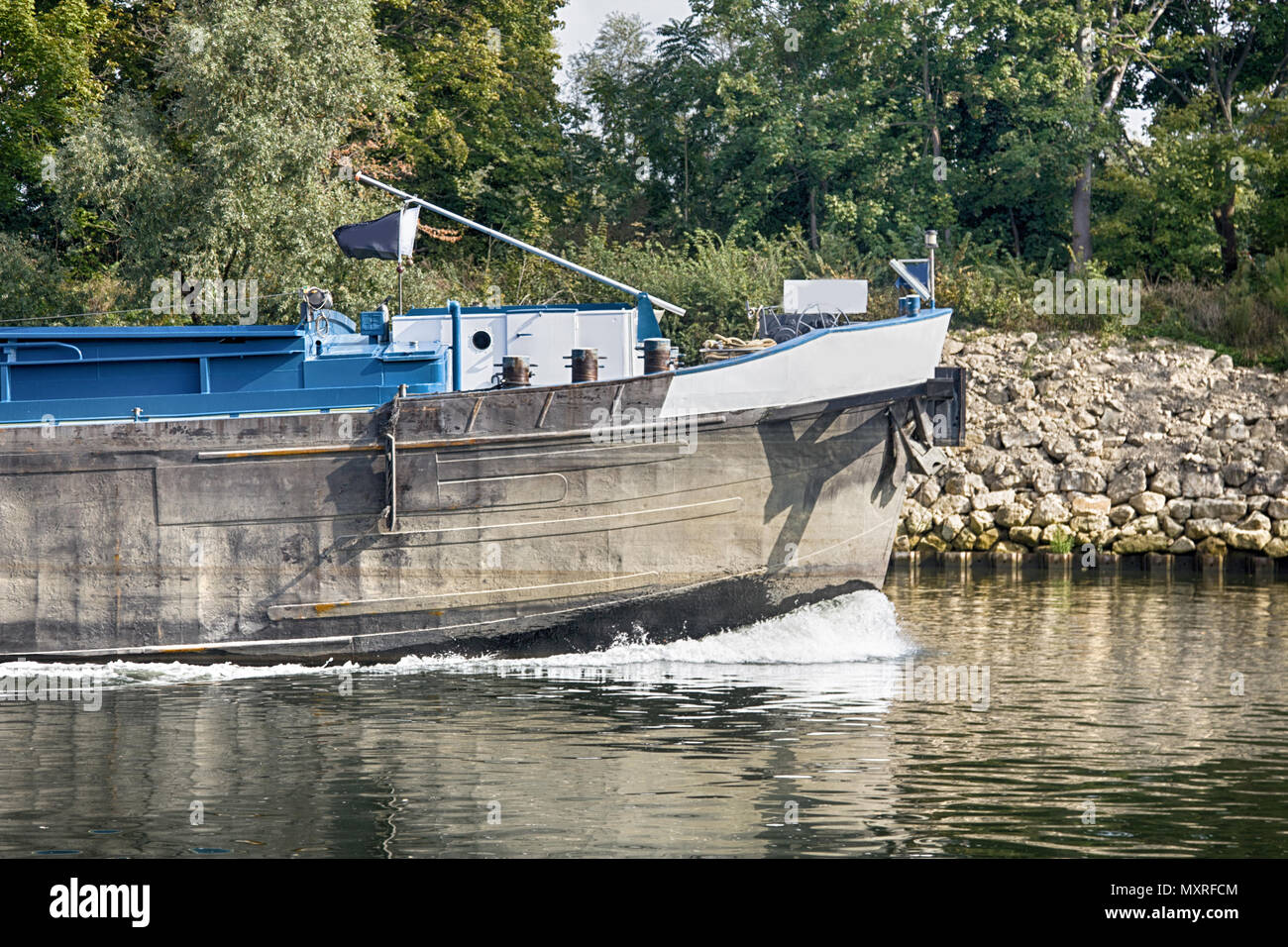 Barge on Seine. cargo ships floating on river Stock Photo - Alamy