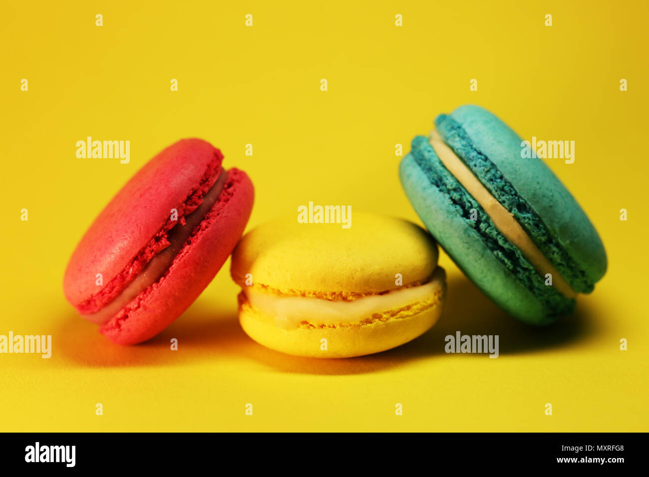 Bright food photography of macroons on yellow background Stock Photo ...